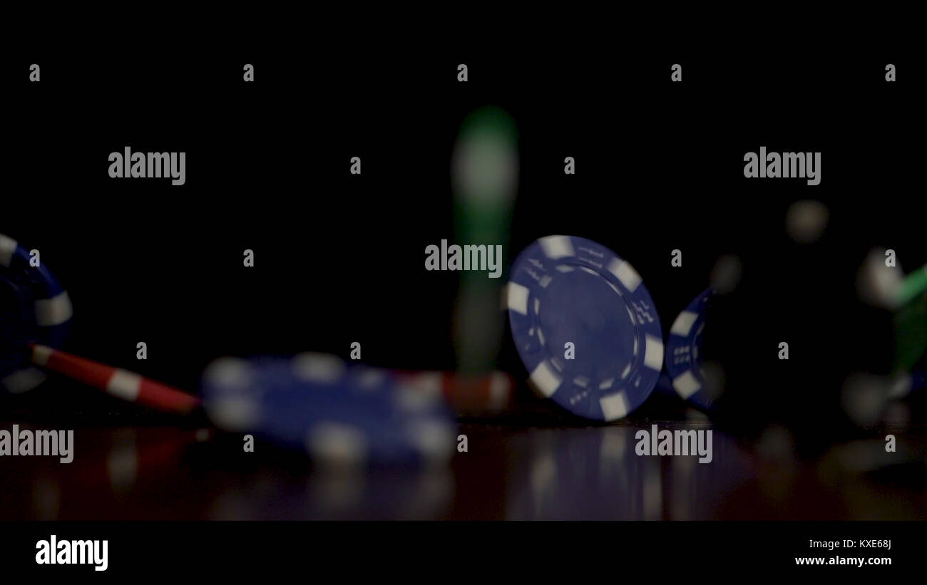 Falling poker chips isolated on black background. Colorful poker chips ...