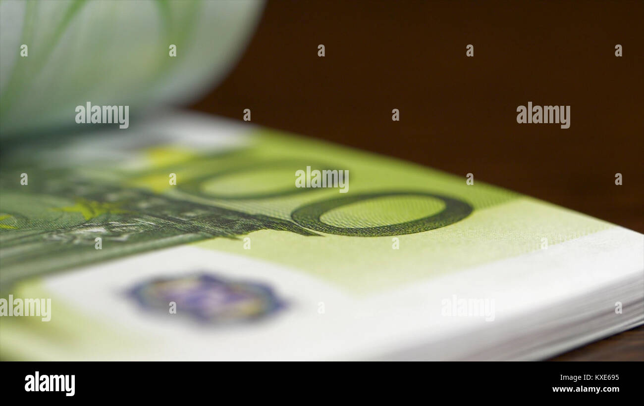 Euro banknotes close up. Several hundred euro banknotes stacked by ...