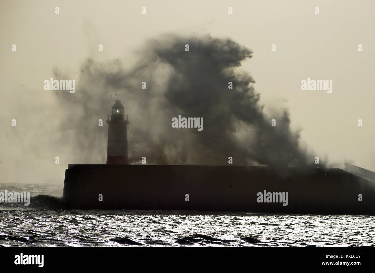 Wave crashing over a Lighthouse Stock Photo - Alamy