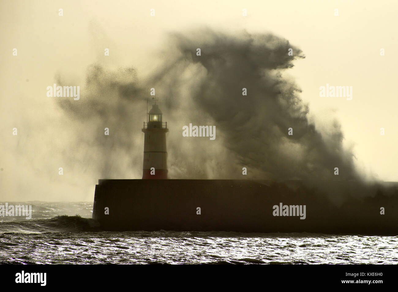 Wave crashing over a Lighthouse Stock Photo - Alamy