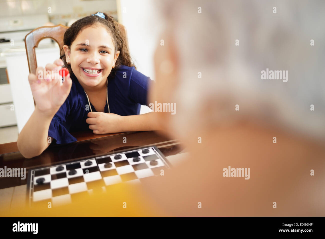Girl playing board game hi-res stock photography and images - Alamy