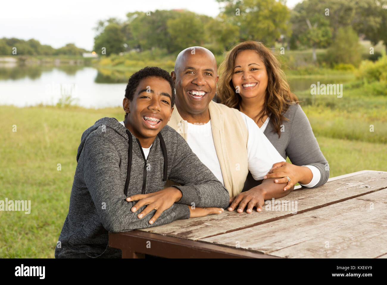 Happy Family Outside Stock Photo - Alamy