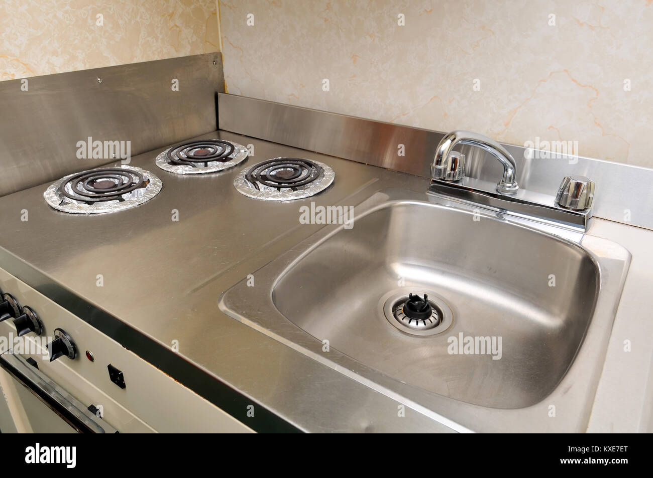 Clean cooking stoves with stainless steel washing area Stock Photo - Alamy