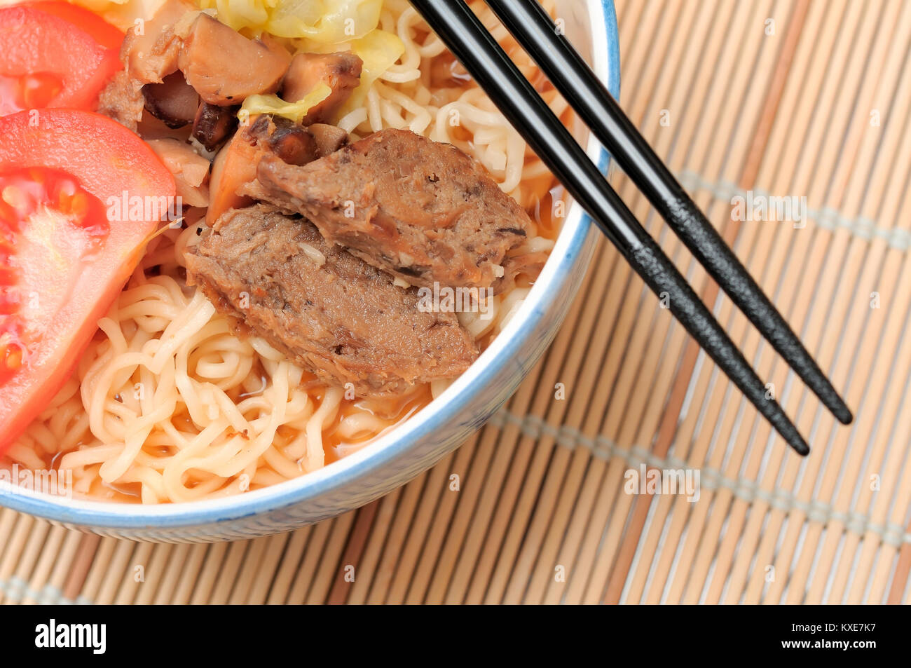 Spicy mutton yellow noodles served in Japanese kitchenware Stock Photo ...