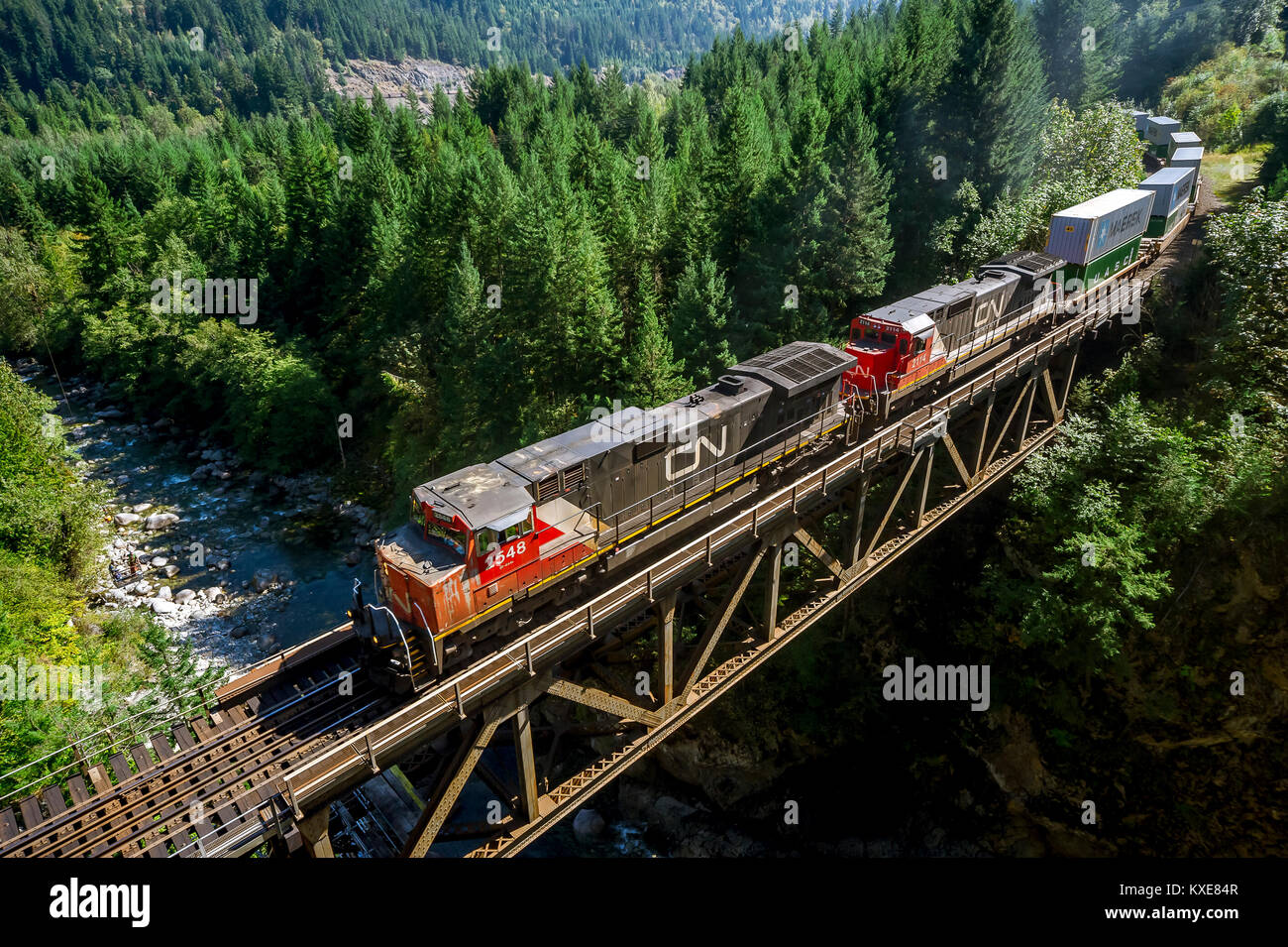 CNR intermodal train led by loco 2548 eastbound crosses Spuzzum Creek ...