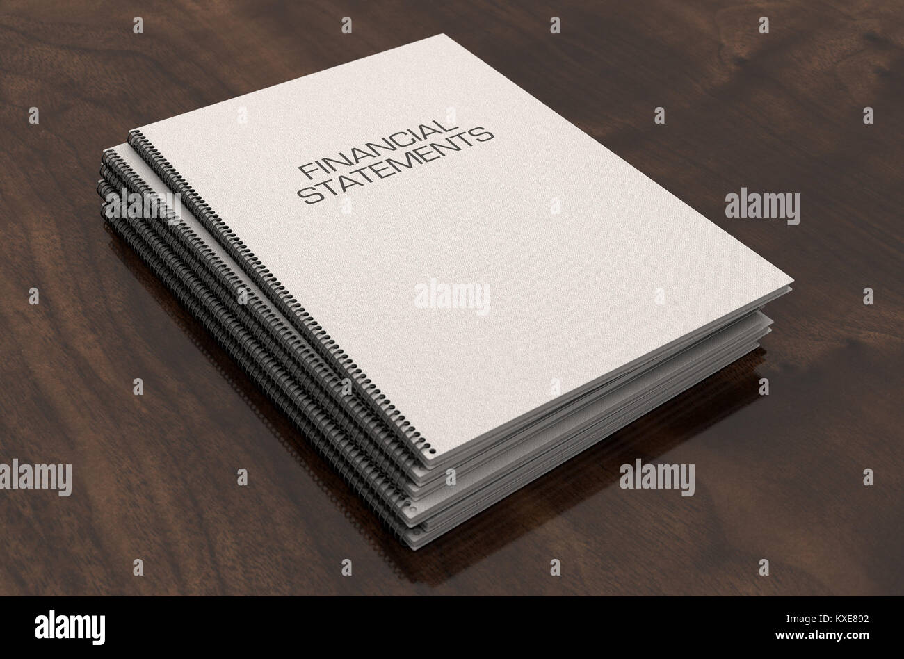 A pile of wire bound financial statement documents in a pile on a ...