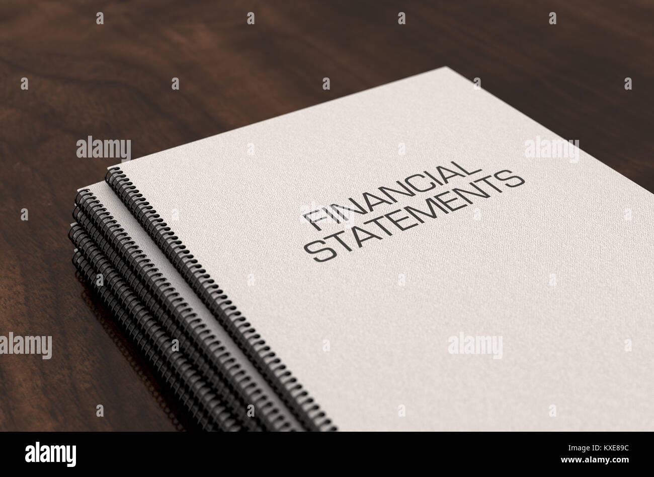A pile of wire bound financial statement documents in a pile on a ...