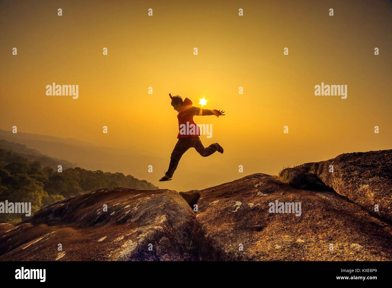 Man jump through the gap. Element of design Stock Photo - Alamy