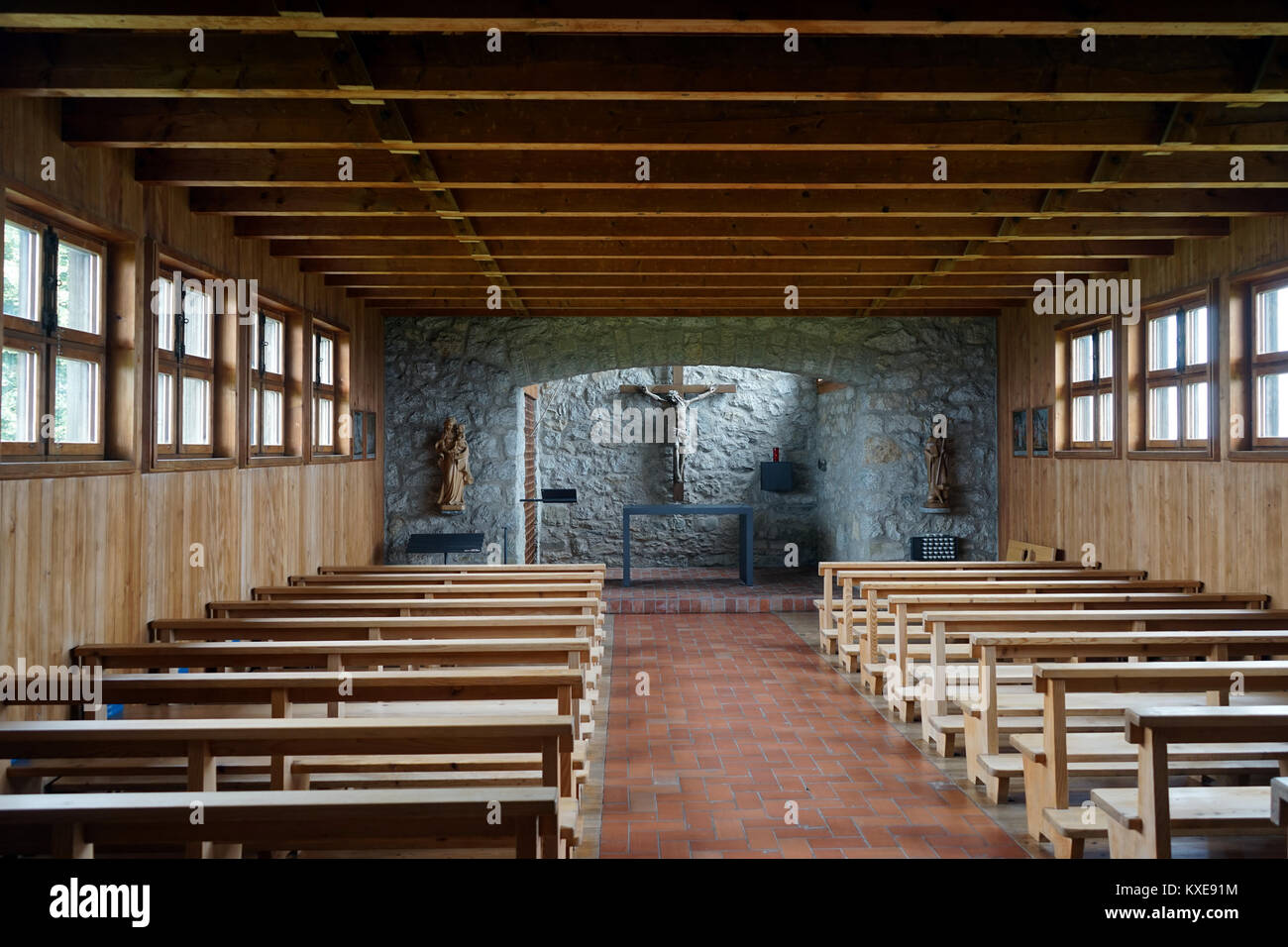 Inside wooden church with crucifix in Switzerland Stock Photo - Alamy