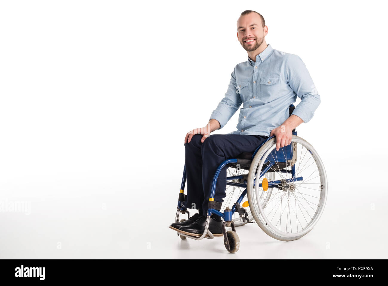 Handsome man in wheelchair Stock Photo - Alamy