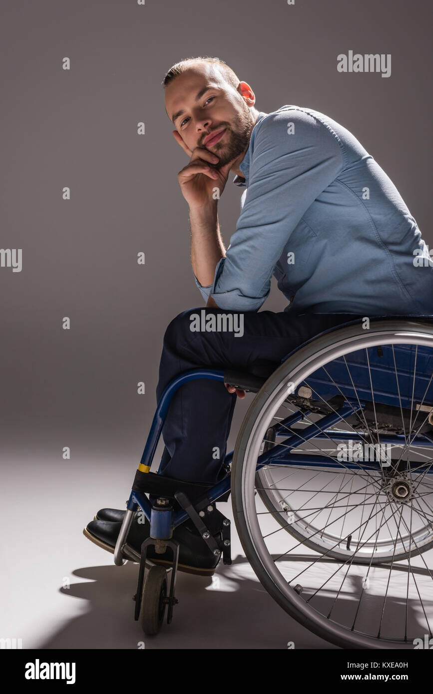 Smiling man in wheelchair Stock Photo - Alamy