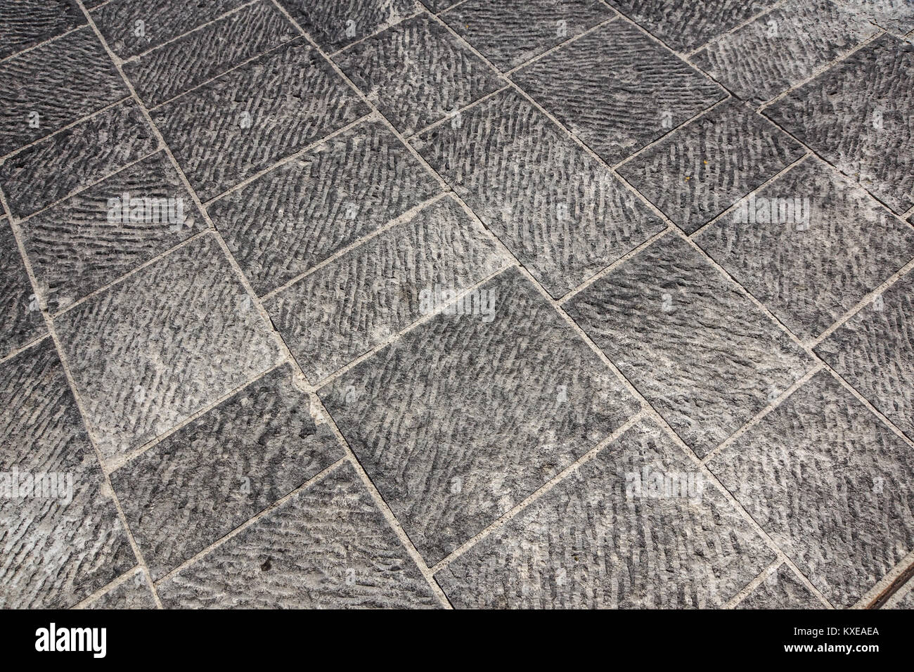 Outdoor street tiles with geometric pattern.The texture of perspective ...