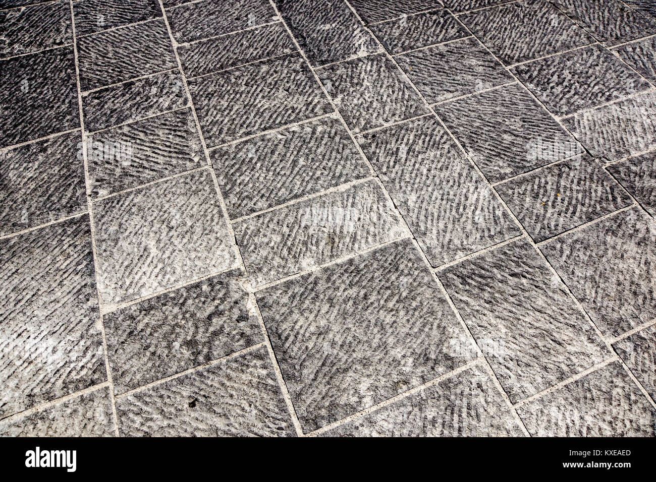 Outdoor street tiles with geometric pattern.The texture of perspective ...