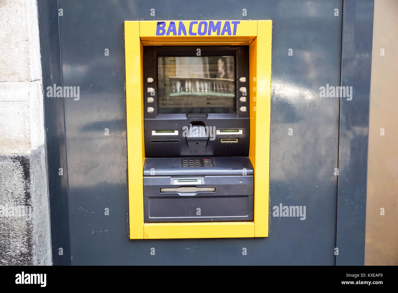 ATM in the mall without people, gray wall outdoors Stock Photo - Alamy