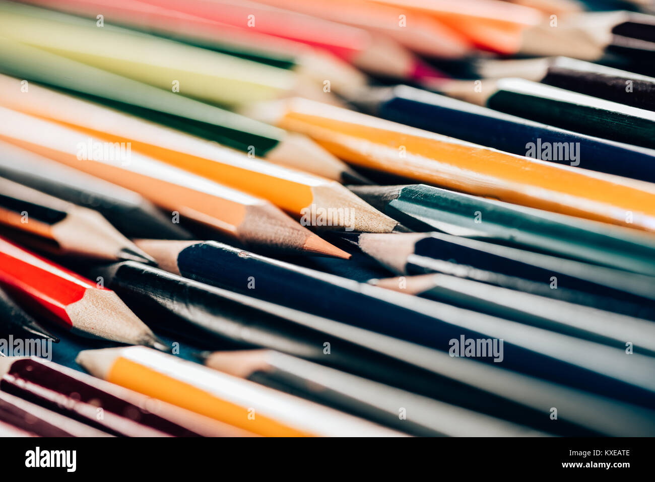 Close-up view of colorful pencils in mess as educational background ...