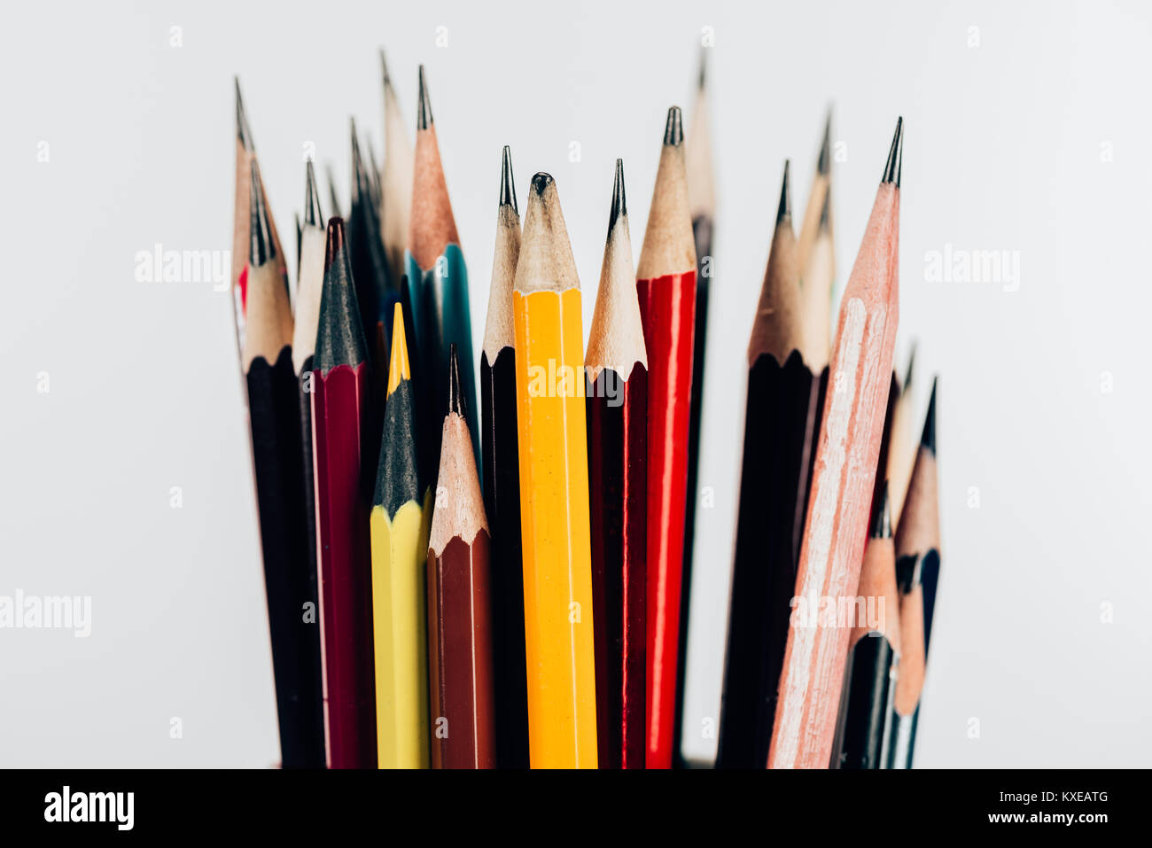 Close-up view of colorful pencils in mess isolated on white background ...