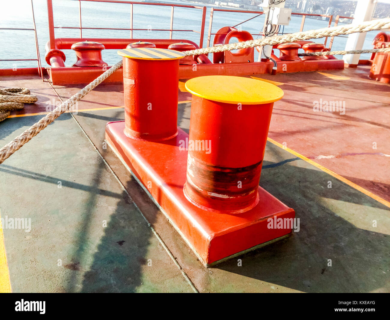 Mooring bollard on the decks of an industrial seaport Stock Photo - Alamy