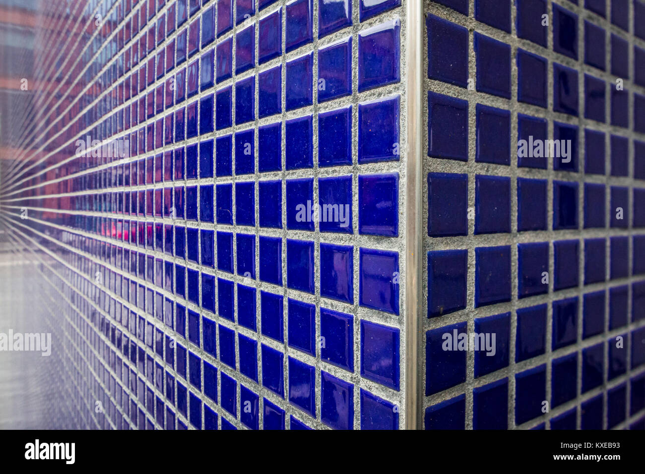 Blue tiled corner of a building Stock Photo - Alamy