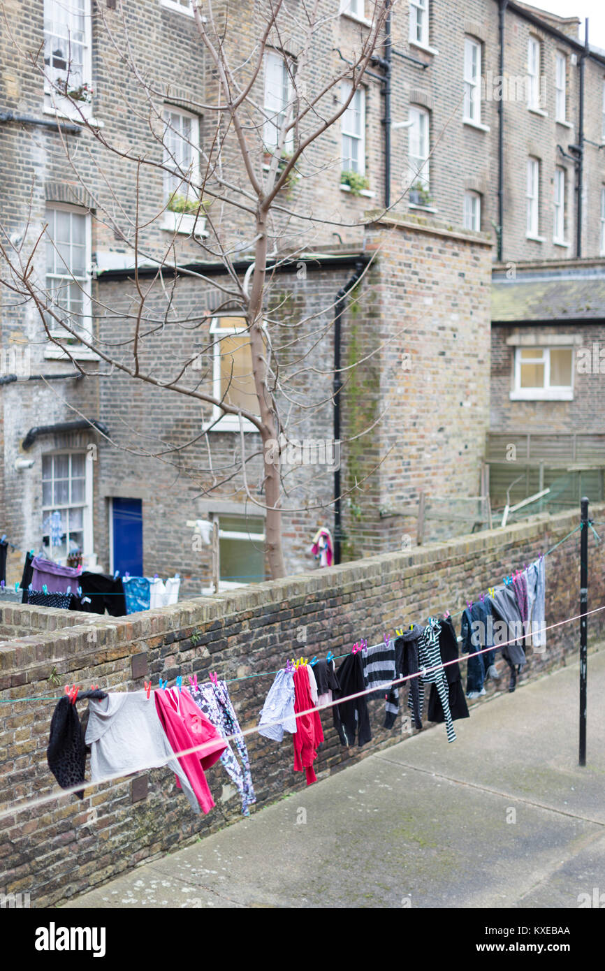 Laundry dries in a breeze on a line outside a housing block Stock Photo ...