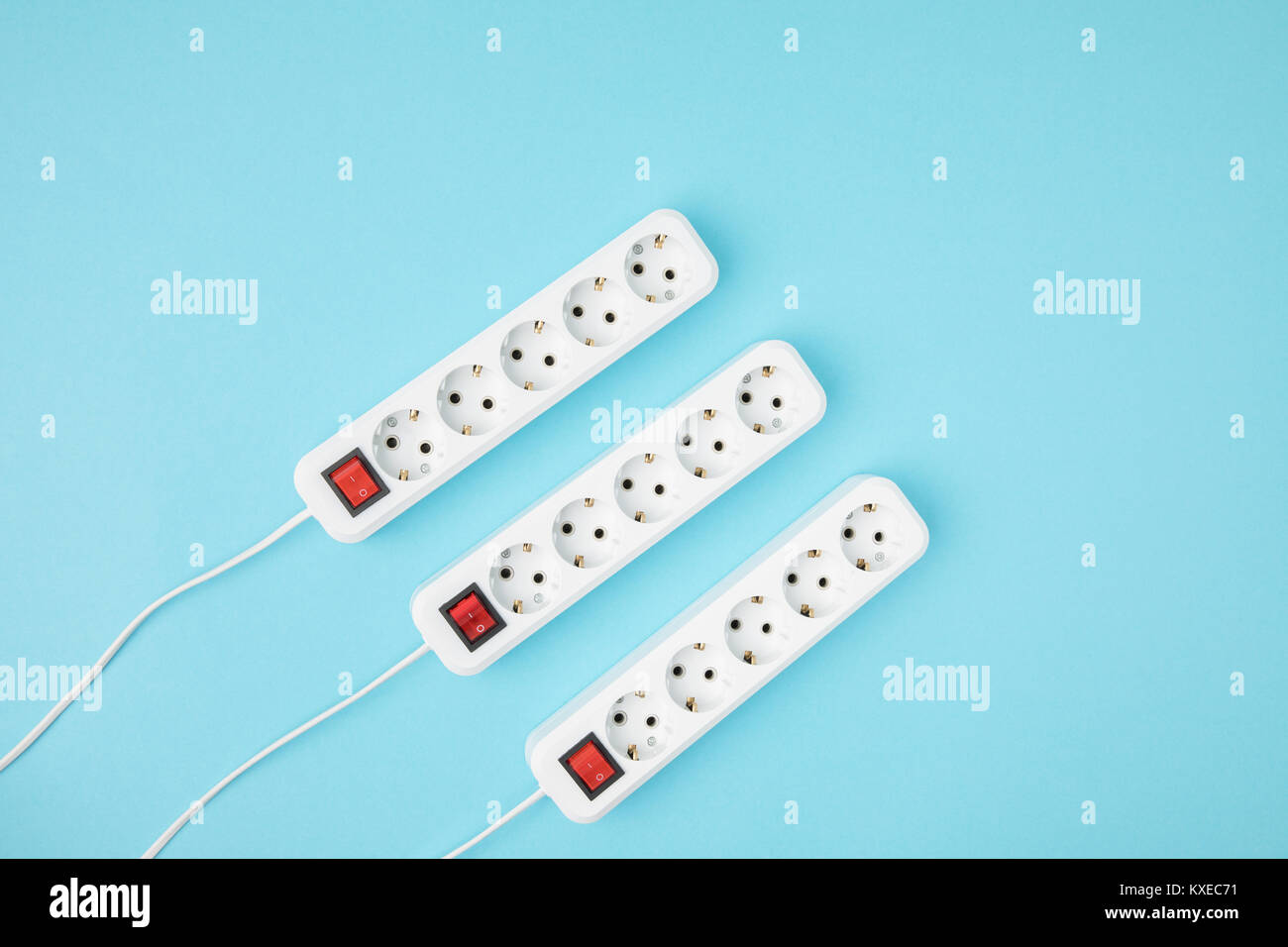 top view of arrangement of extension cords isolated on blue Stock Photo ...