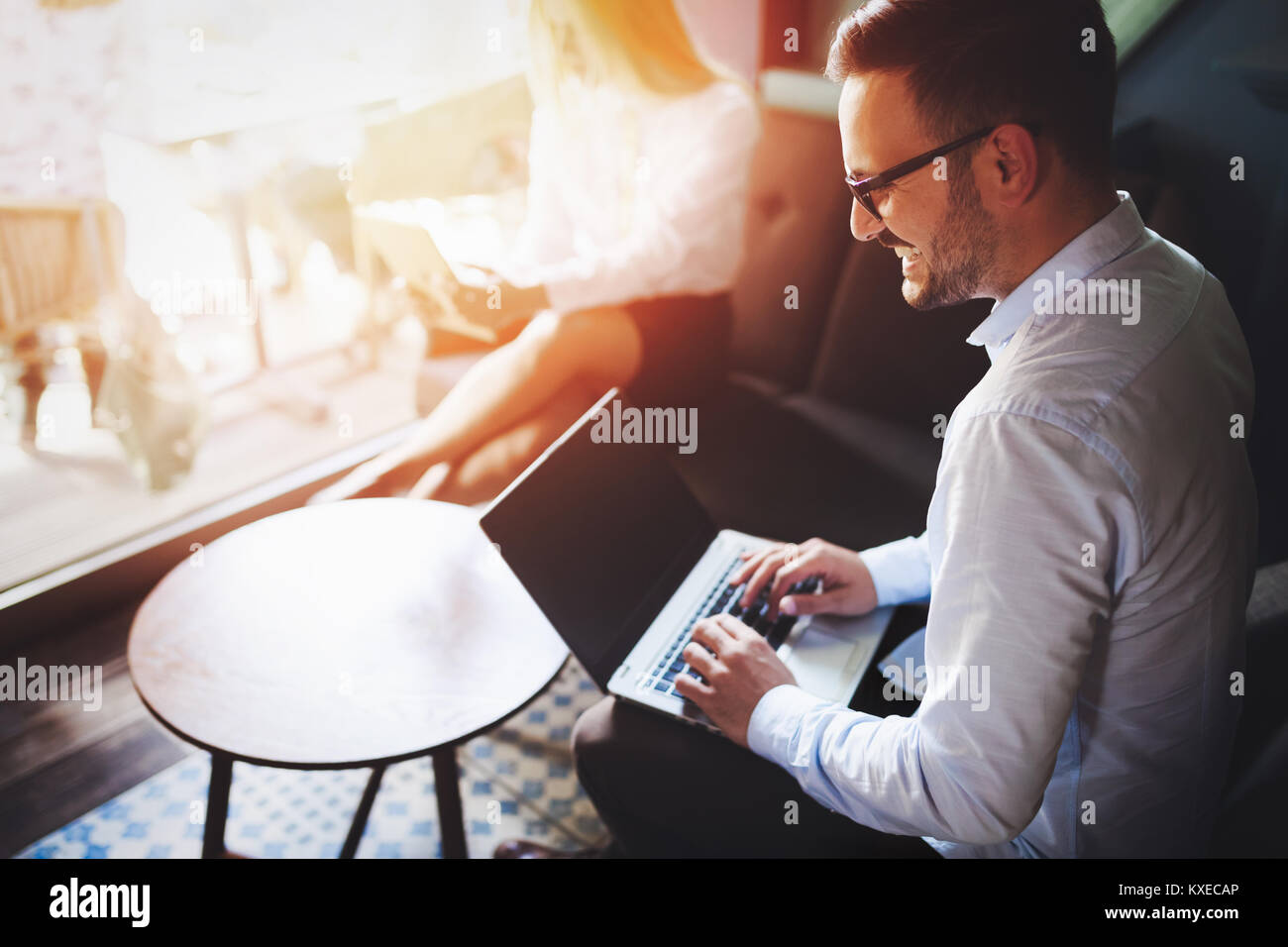 Happy colleagues from work socializing in restaurant Stock Photo - Alamy