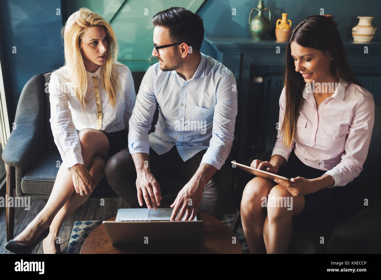 Happy colleagues from work socializing in restaurant Stock Photo - Alamy