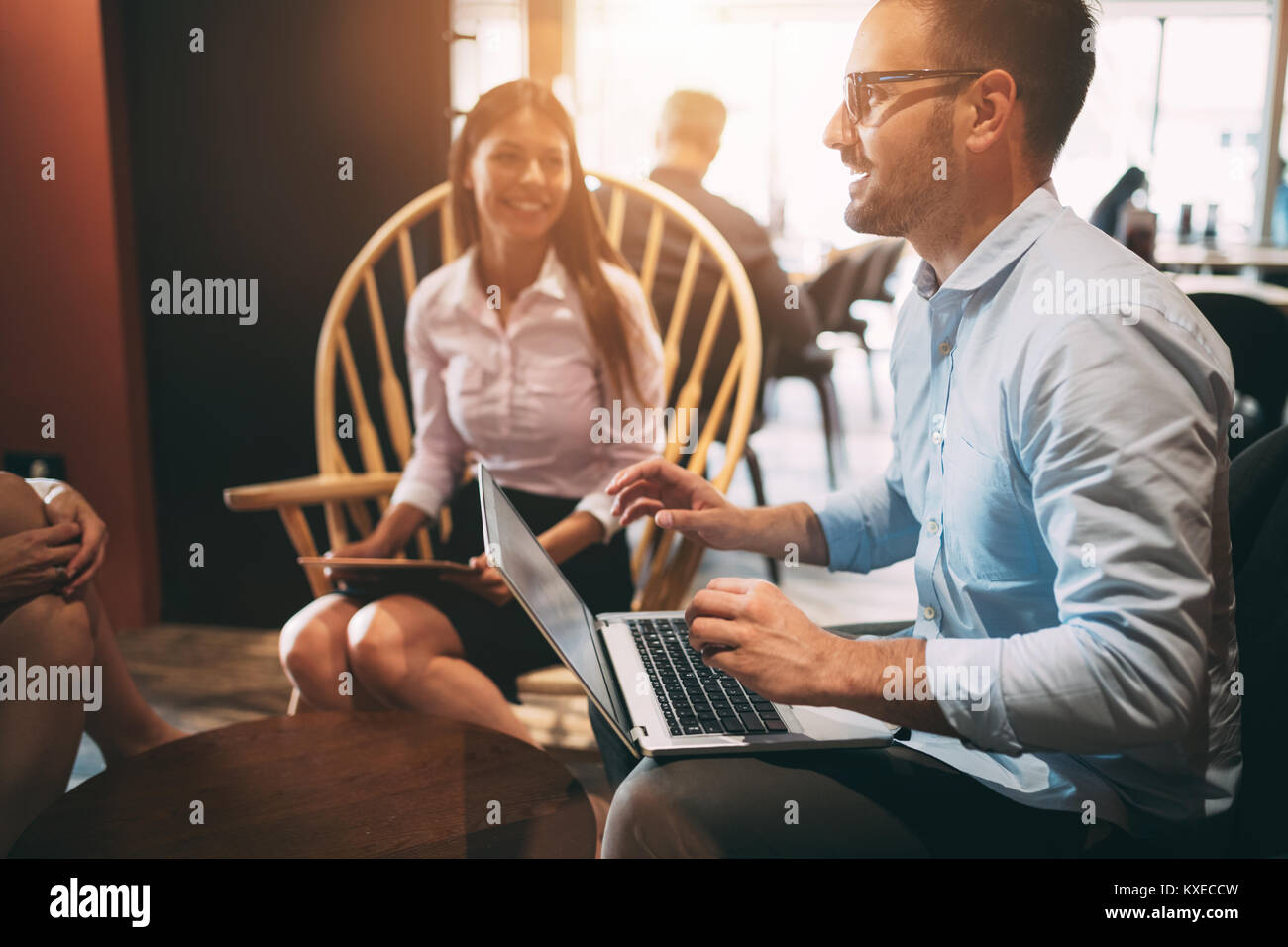Group socialising work hi-res stock photography and images - Alamy