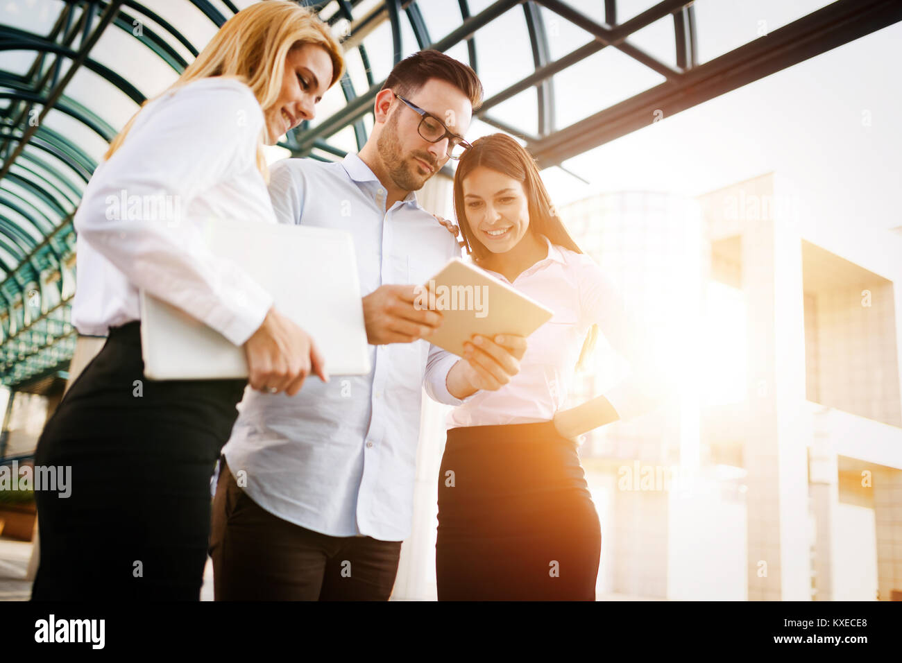 Happy business colleagues in modern office Stock Photo - Alamy