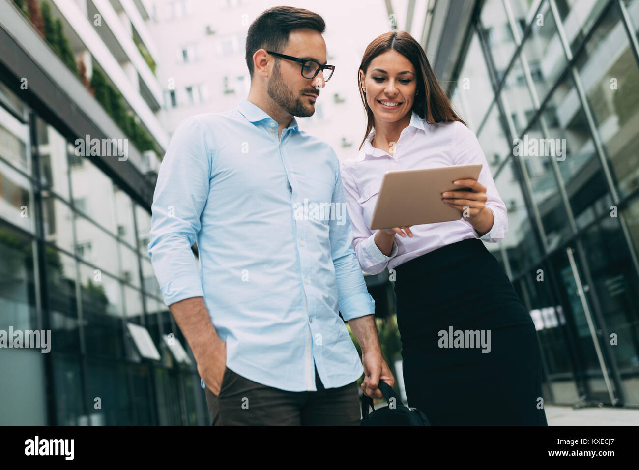 Picture of handsome man and beautiful woman as business partners Stock ...