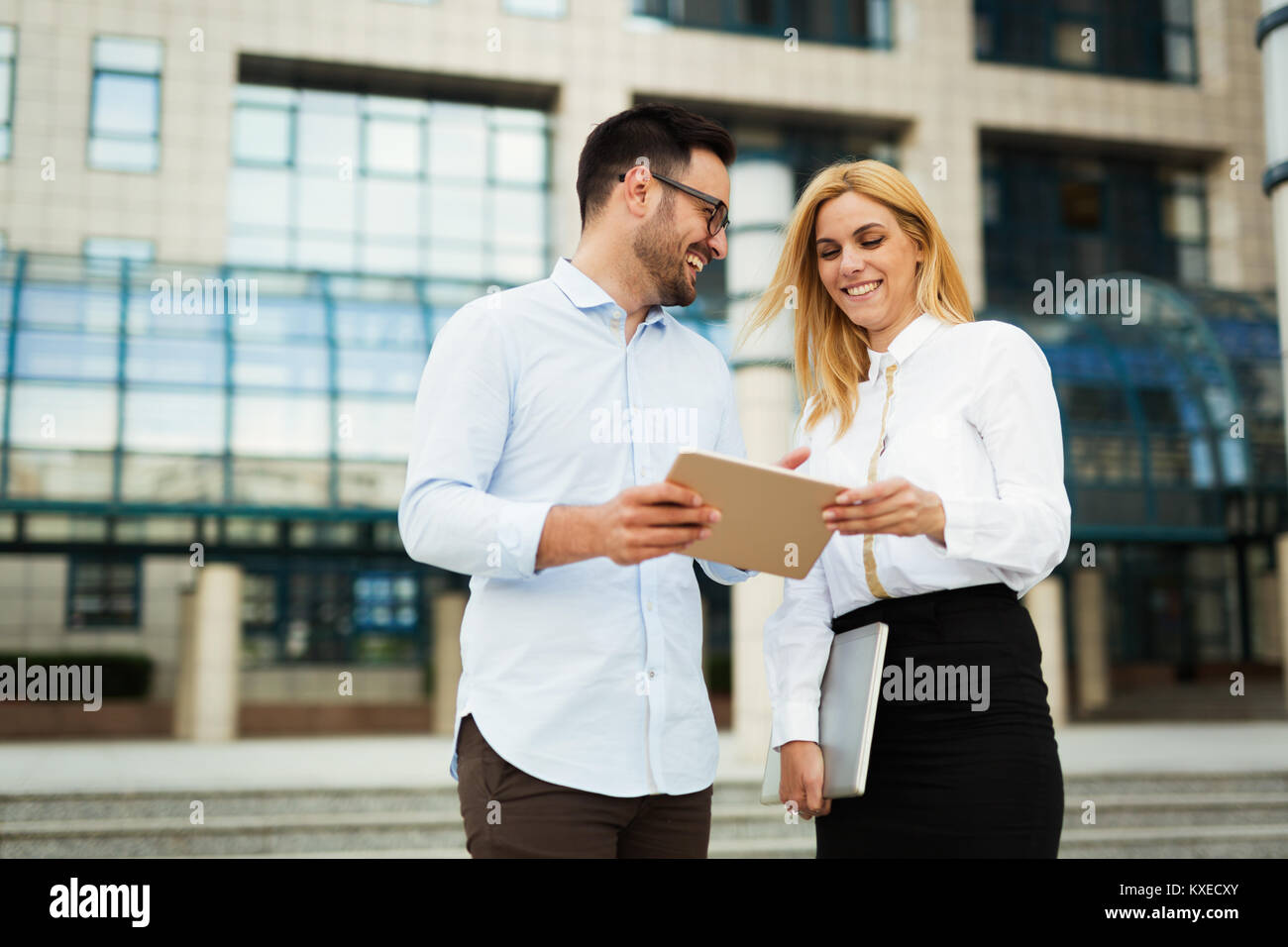 Young business people cooperating Stock Photo - Alamy