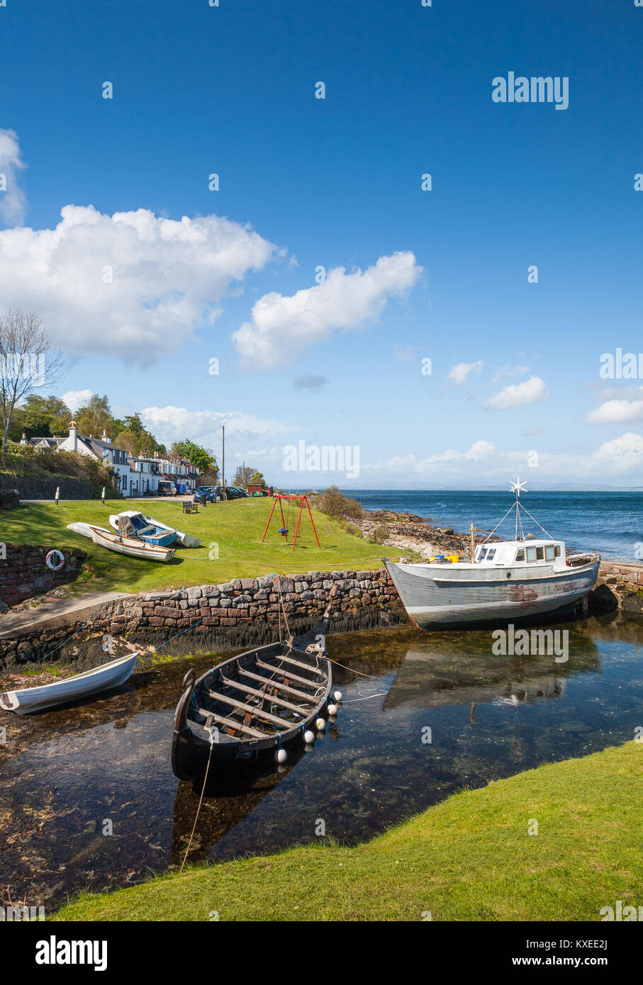 Boats moored at Corrie harbour and village, Isle of Arran, Scotland, UK ...