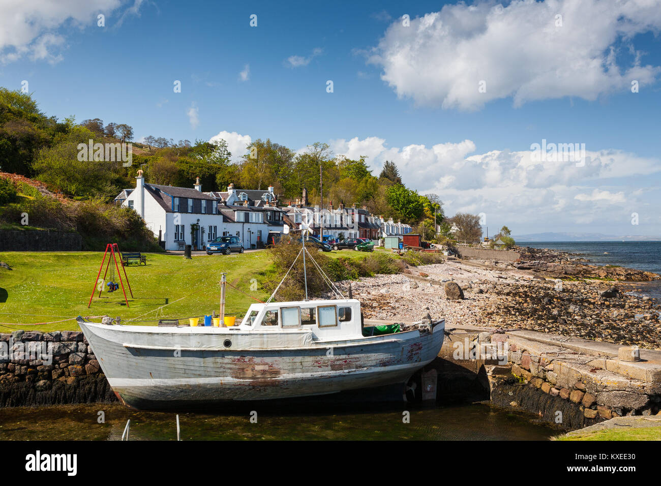 Boats moored at Corrie harbour and village, Isle of Arran, Scotland, UK ...