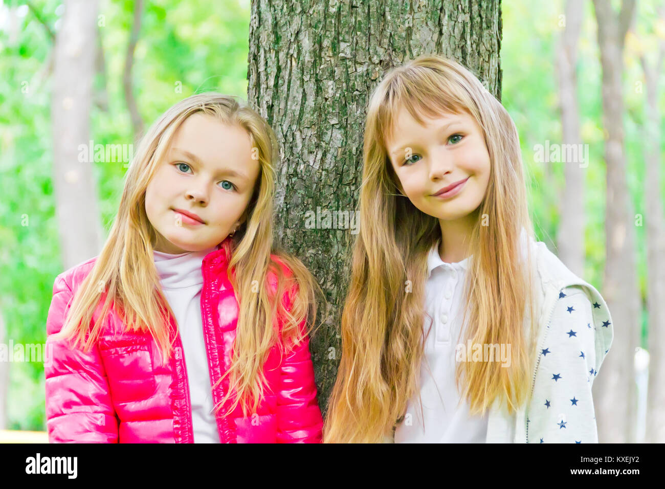 Photo of two cute girls with long hairs Stock Photo - Alamy