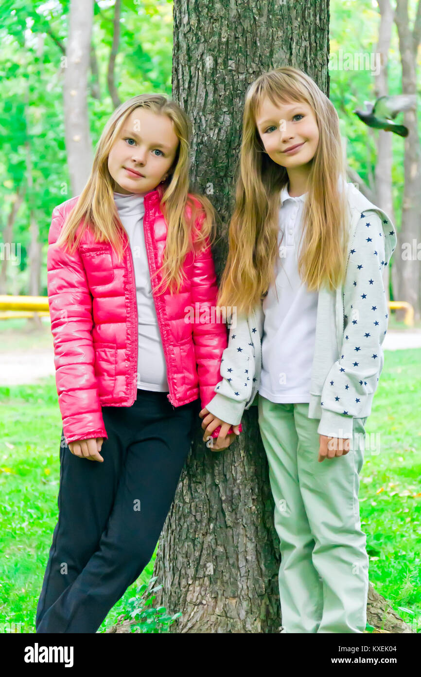 Photo of two cute girls with long hairs Stock Photo - Alamy