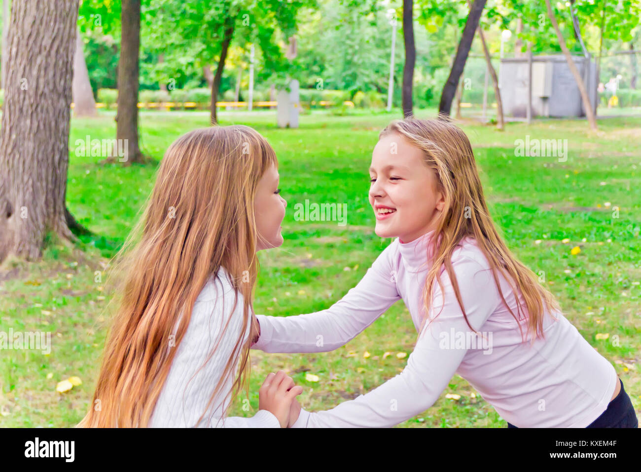 Photo of two playing girls in summer Stock Photo - Alamy