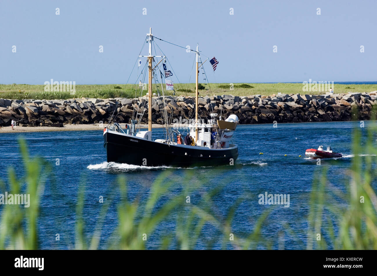 A private restored Gloucester style fishing trawler passes throught he ...