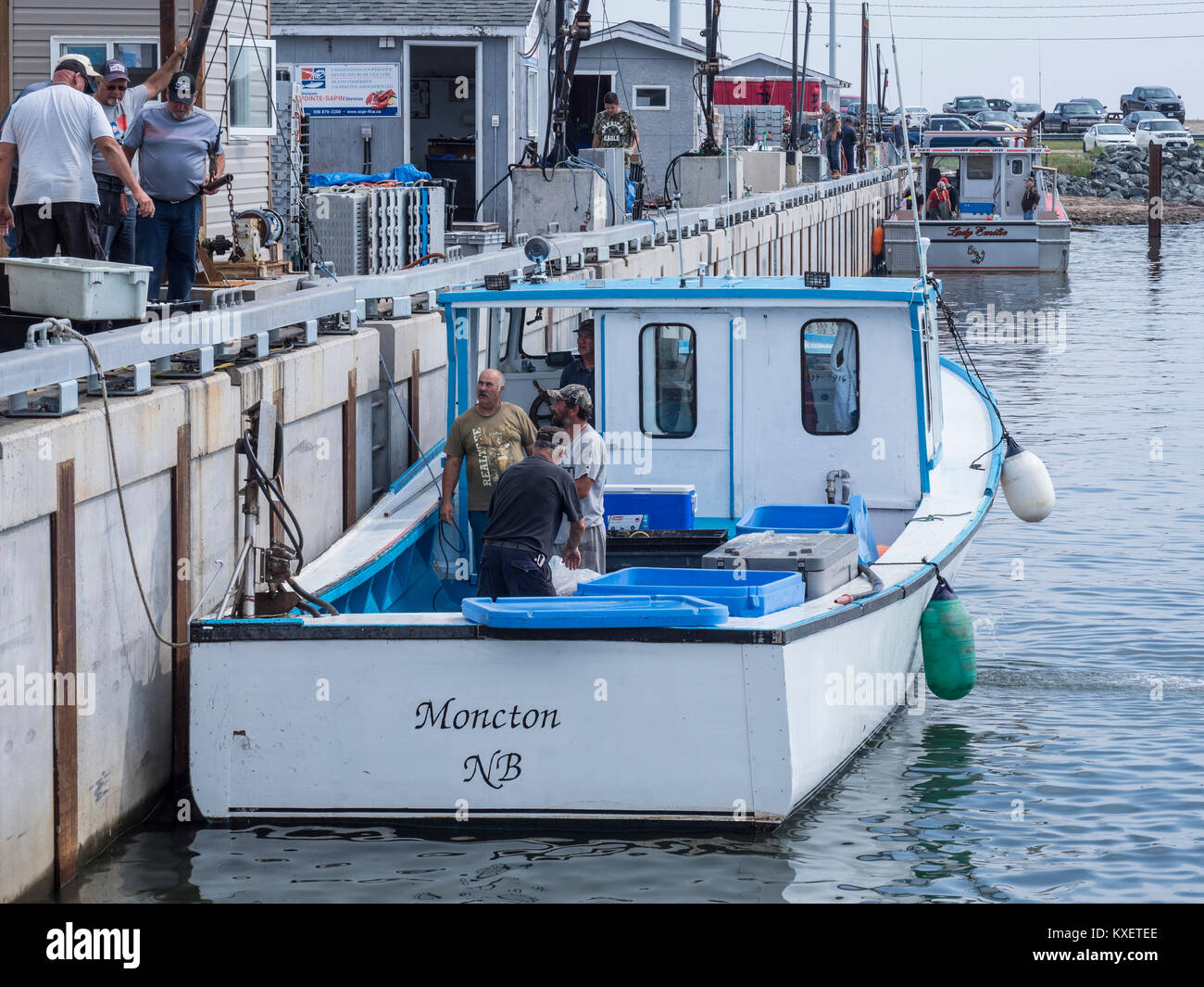 Lobster boat loading ice, Pointe-Sapin, New Brunswick, Canada Stock ...