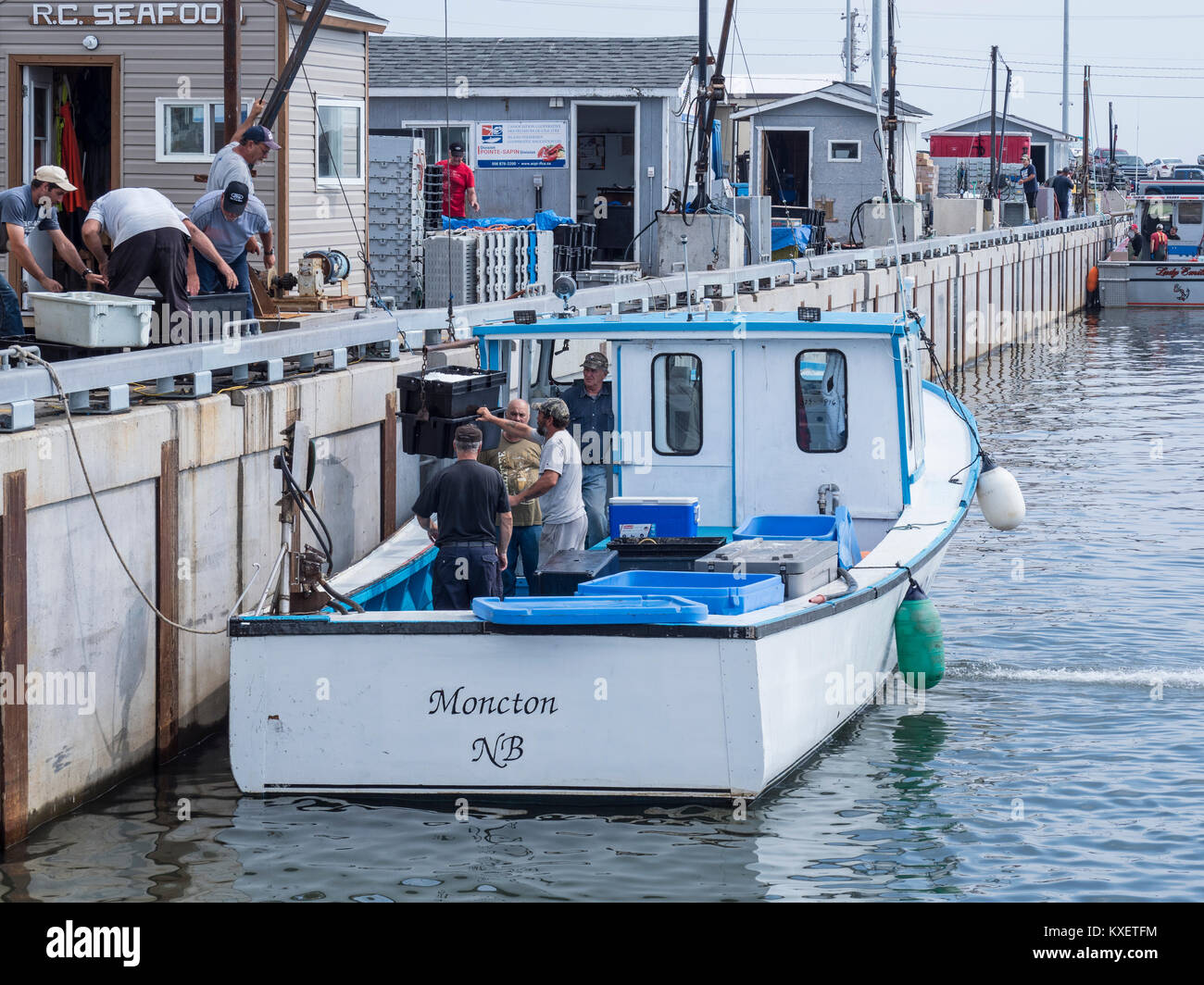 Lobster boat loading ice, Pointe-Sapin, New Brunswick, Canada Stock ...