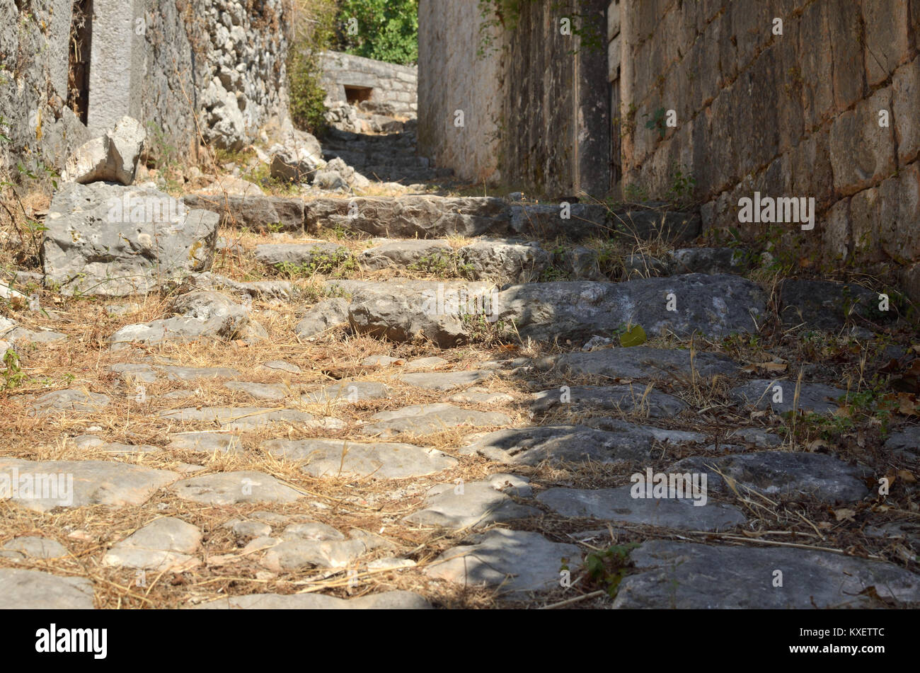 Rustic stone path in a Mediterranean village Stock Photo - Alamy