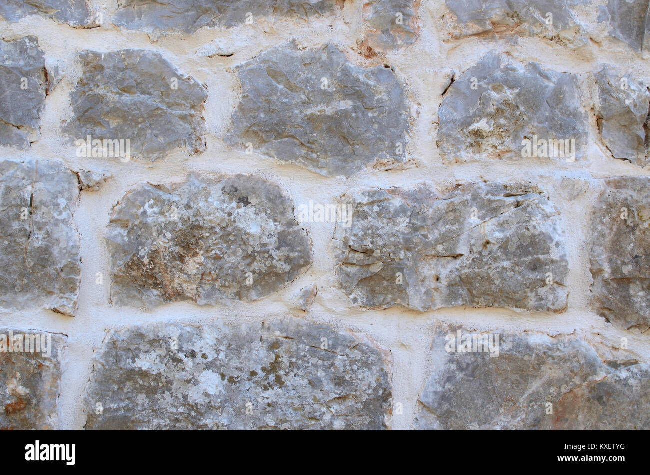 Rustic stone wall made of ancient stone in coastal village Stock Photo ...