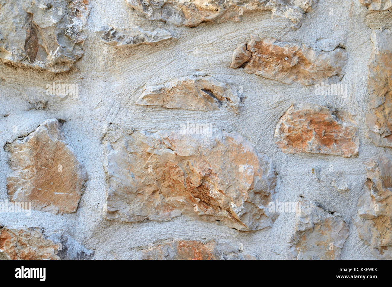 Rough stone wall made of ancient stone in coastal village Stock Photo ...