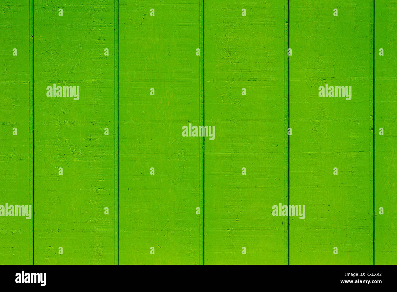 Bright lime green wooden background texture of parallel vertical timber ...