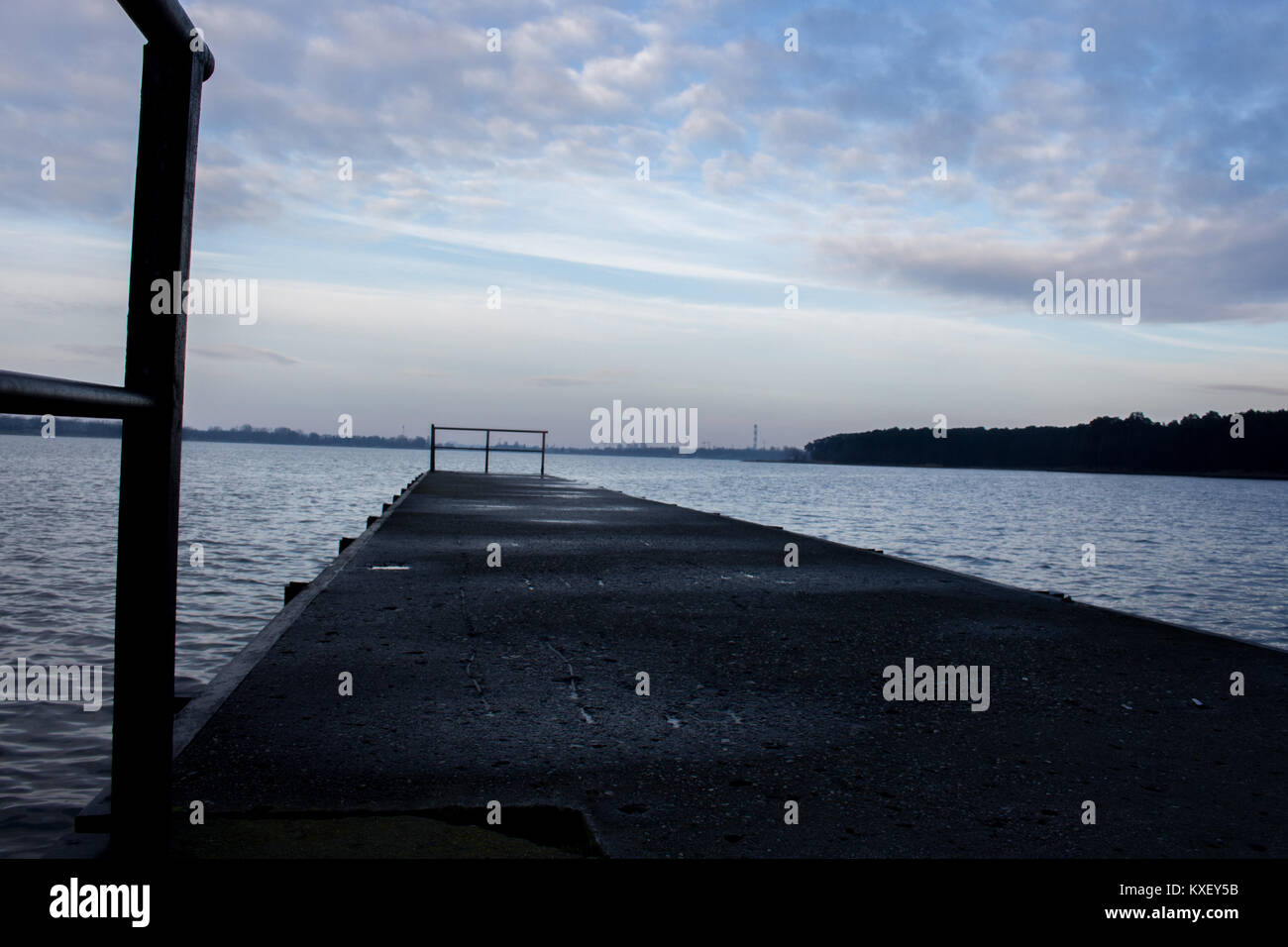 empty pier, pier or jetty on blue lake Stock Photo - Alamy