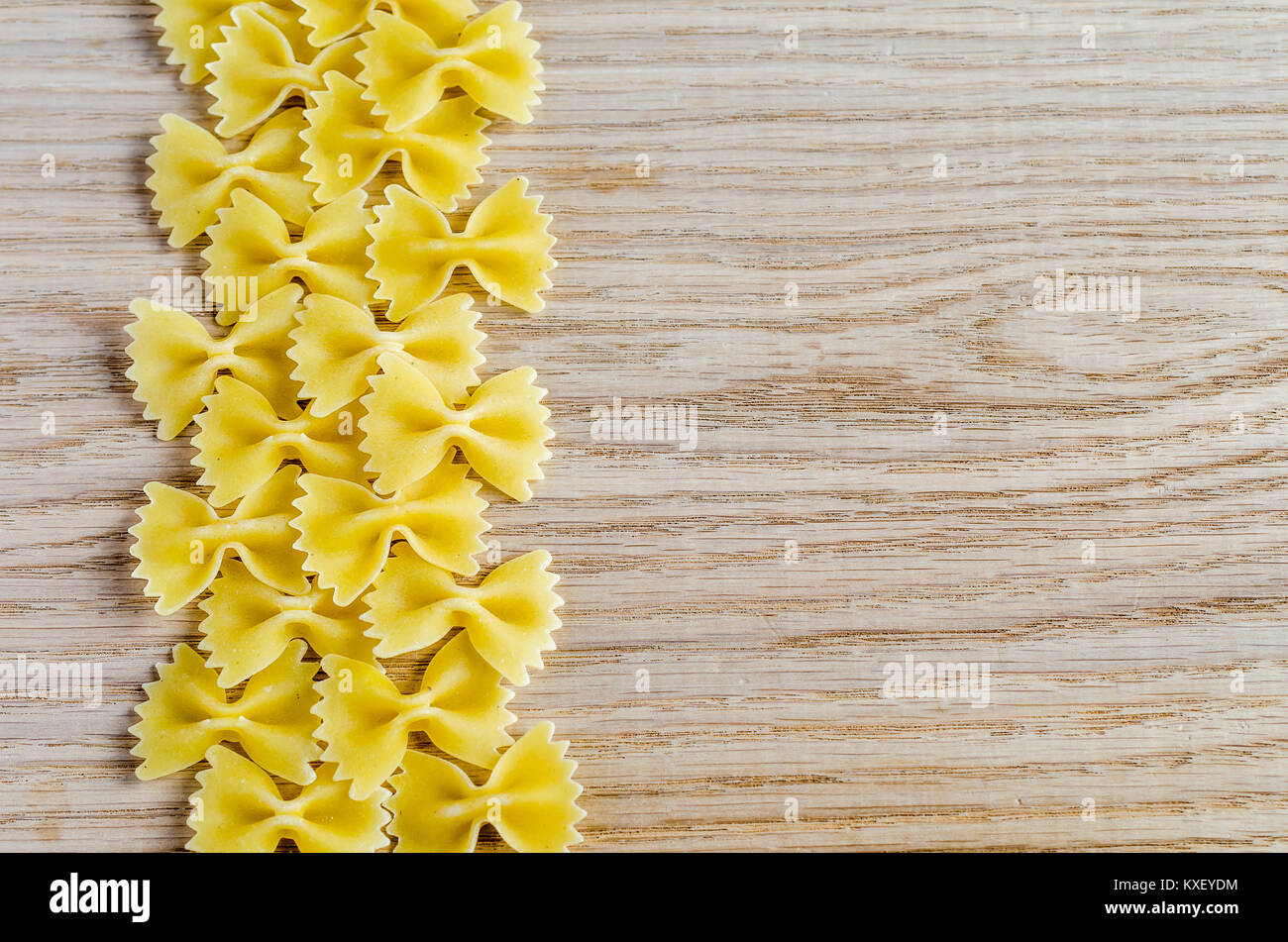 Uncooked farfalle pasta background Stock Photo - Alamy