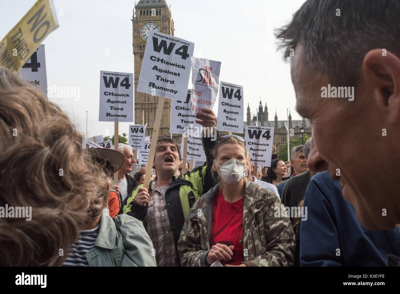 People listen and shout support at the rally in Parliament Square ...
