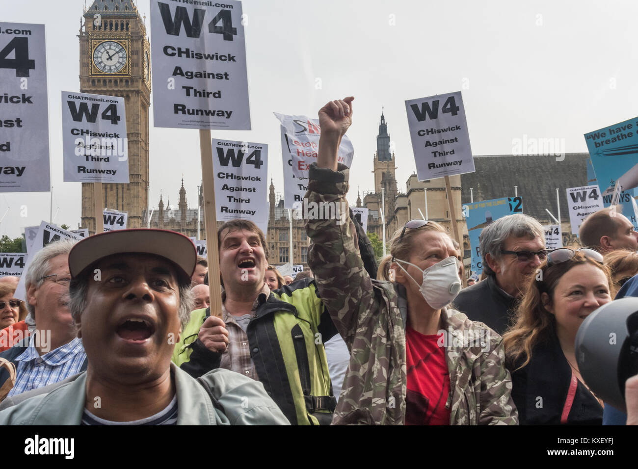 People listen and shout support at the rally in Parliament Square ...