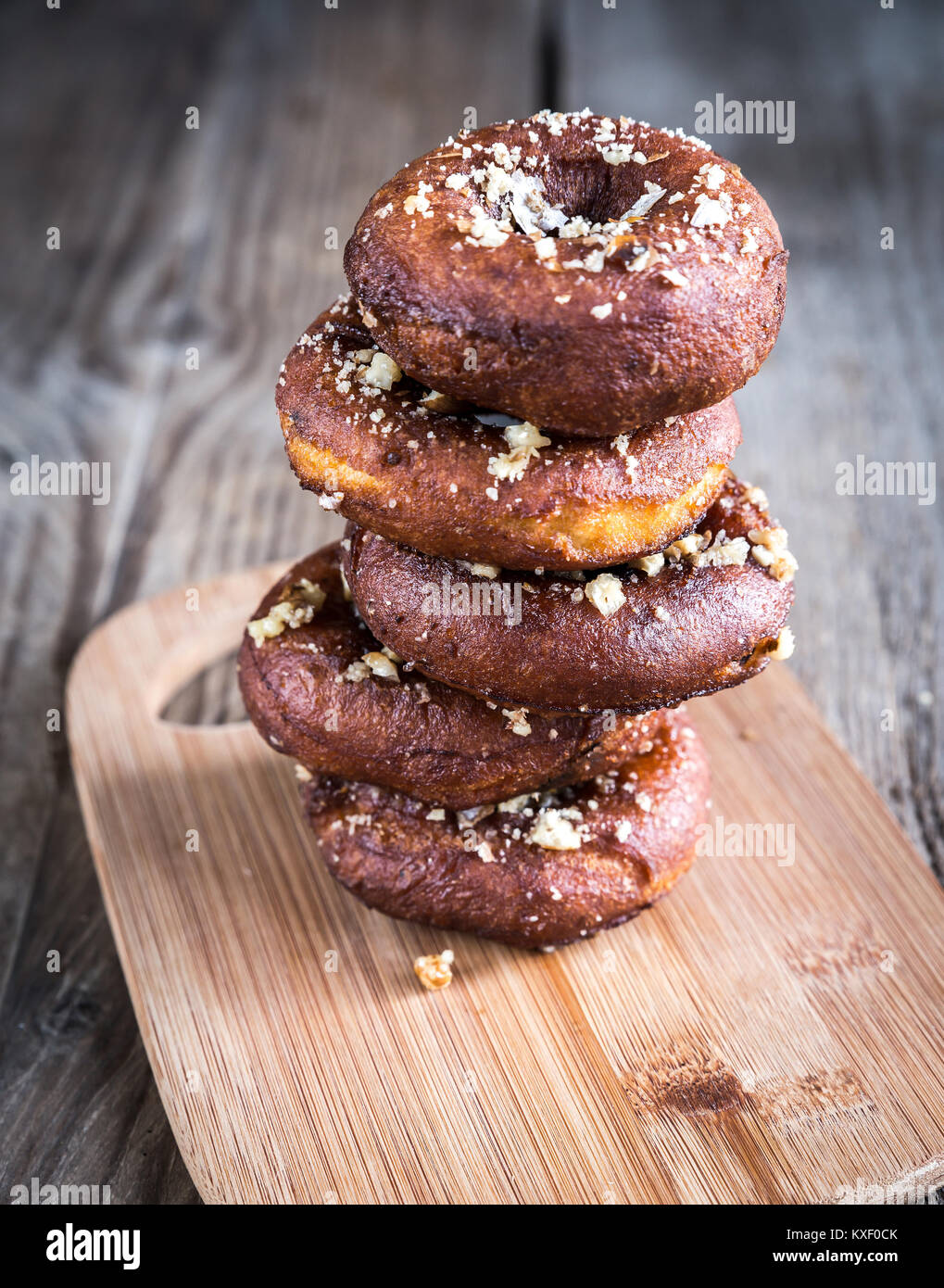Donuts sprinkled with crushed nuts Stock Photo - Alamy