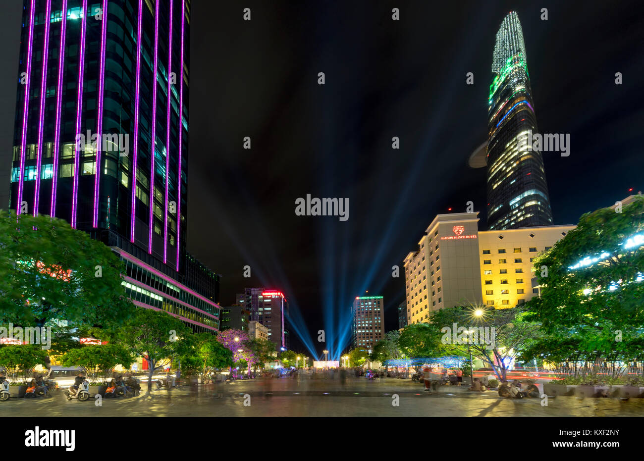 Night view on pedestrian street with wide path along the skyscrapers ...