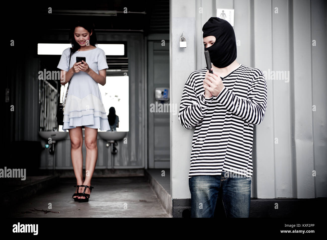 Thief is trying to steal at the public place Stock Photo - Alamy