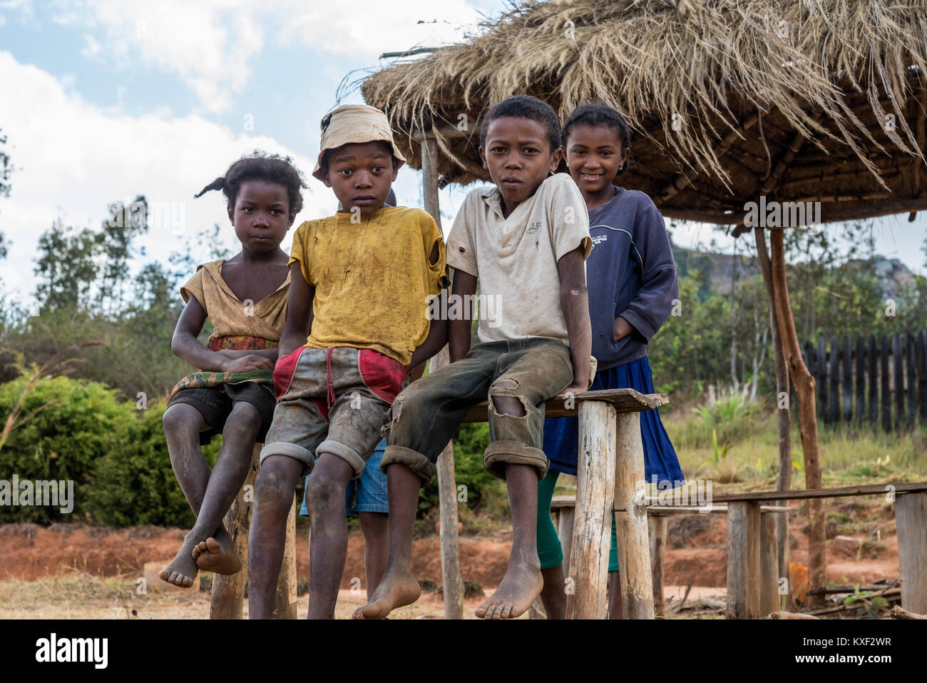 Local kids sitting on a bench. Madagascar, Africa Stock Photo - Alamy